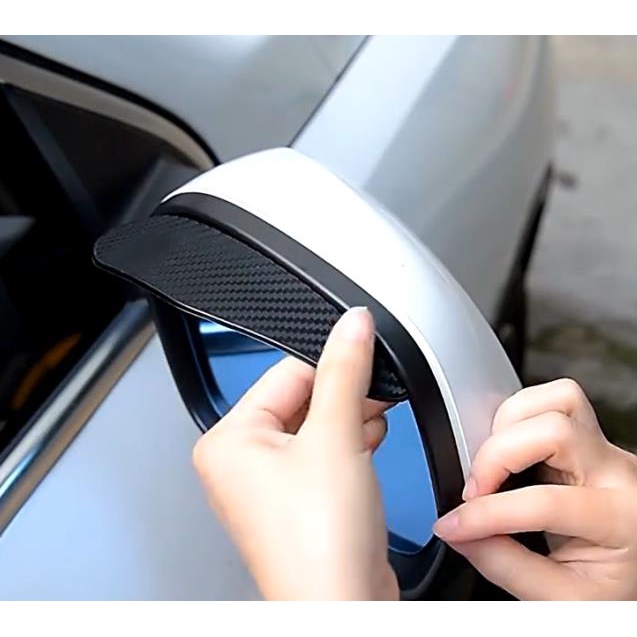 A pair of car rearview mirrors with rain eyebrows and rain shields ...