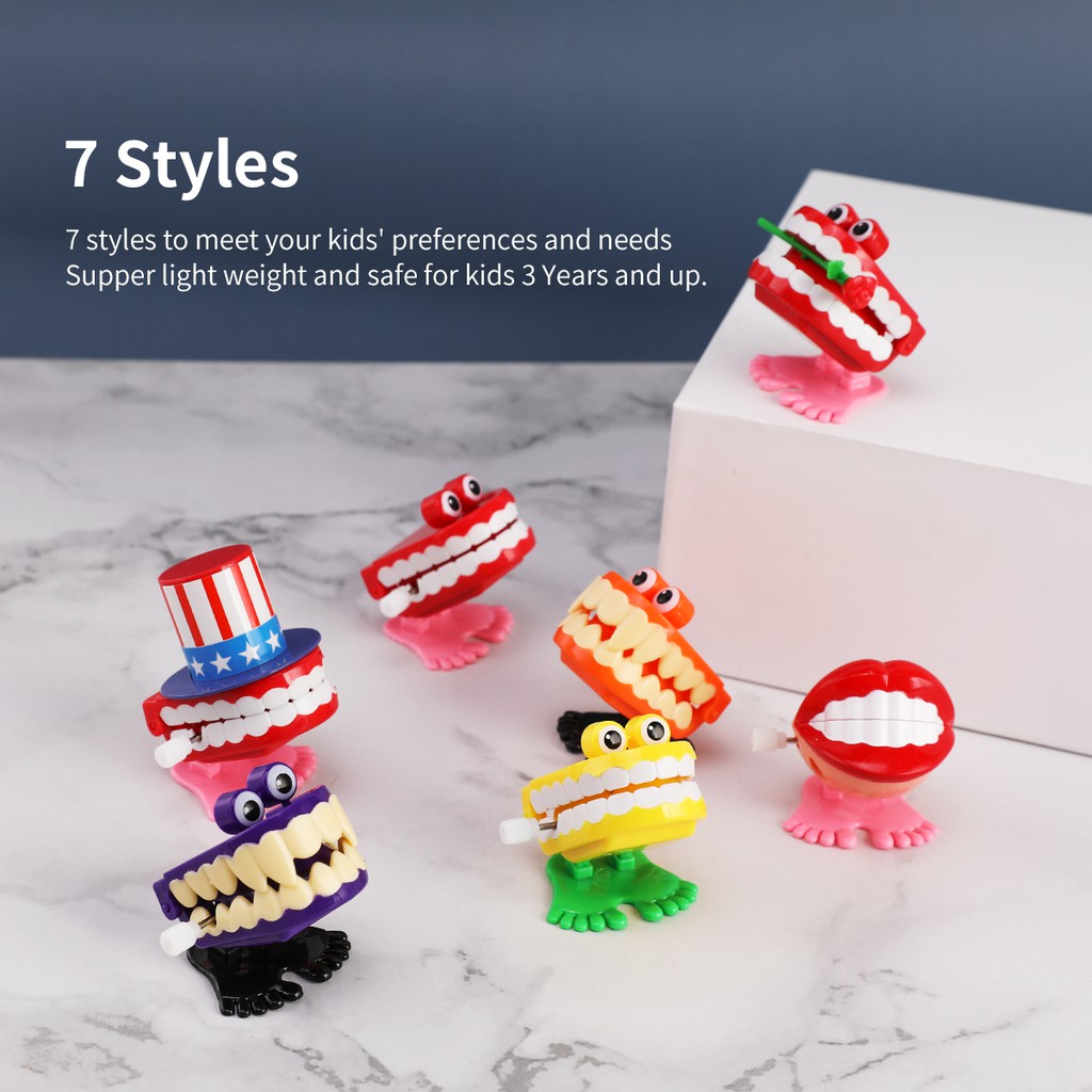 HOT Funny Jumping Teeth Chattering Smile Teeth Small Wind Up Feet Toy ...
